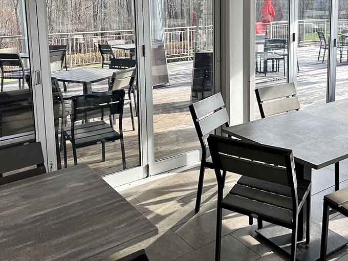 Glass windows and modern seating create a space where nostalgia meets contemporary comfort beautifully.