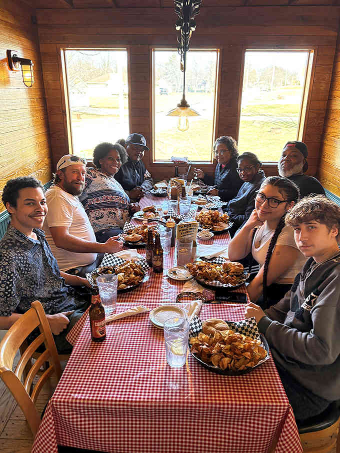 When three generations gather around checkered tablecloths for barbecue, you're witnessing what makes small-town restaurants truly special and irreplaceable.