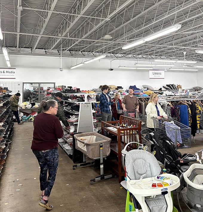 Fellow treasure hunters navigate the aisles with carts and determination, each on their own bargain quest.