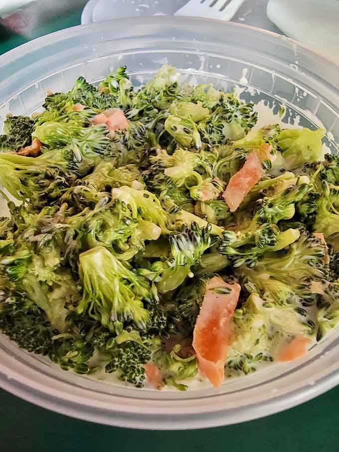 Even the broccoli salad gets the generous treatment here, because vegetables deserve love too, apparently.