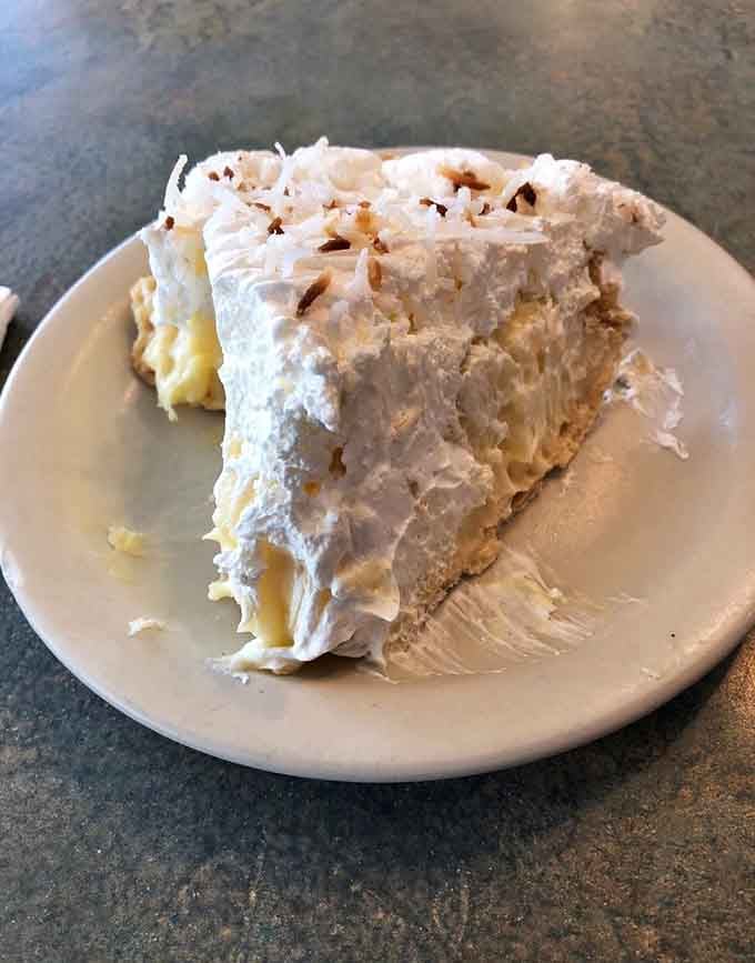 That towering coconut cream pie stands tall and proud, daring you to save room for dessert after your meal.