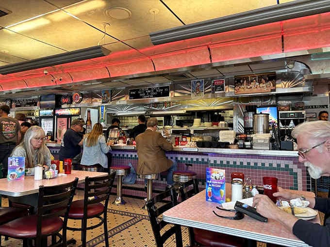 Counter seating where strangers become friends and everyone agrees the coffee's always fresh and flowing freely.