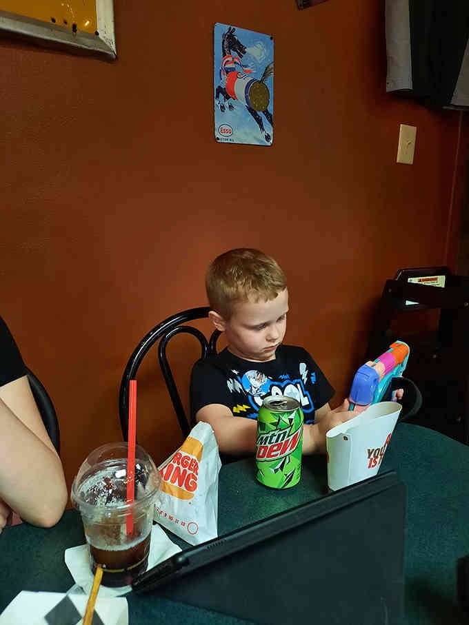 Young diners enjoying their meals in a space where kids can be kids and nobody's judging the occasional food-related mess.
