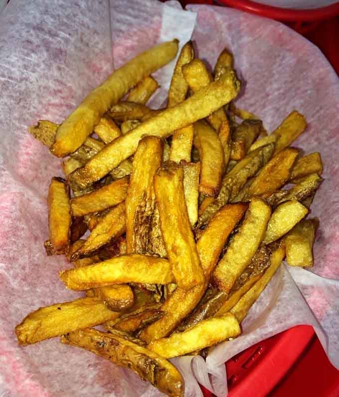 Golden fries seasoned to perfection, proving that simplicity done right beats complexity every single time.
