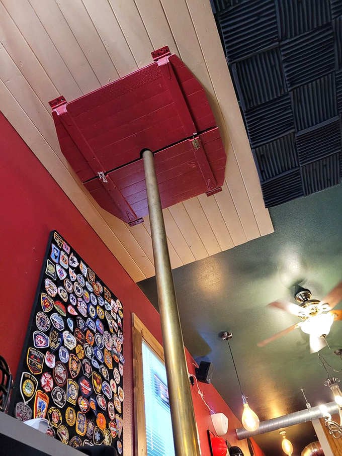 That fire pole stretching to the ceiling isn't just decor, it's childhood dreams made architectural reality.