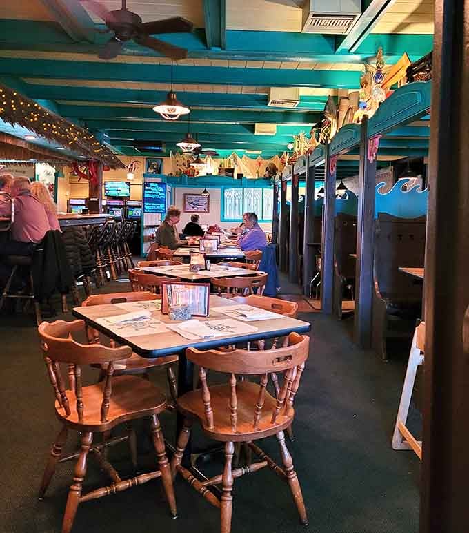 The dining room's turquoise beams and tropical touches create an atmosphere that defies all geographical logic beautifully.