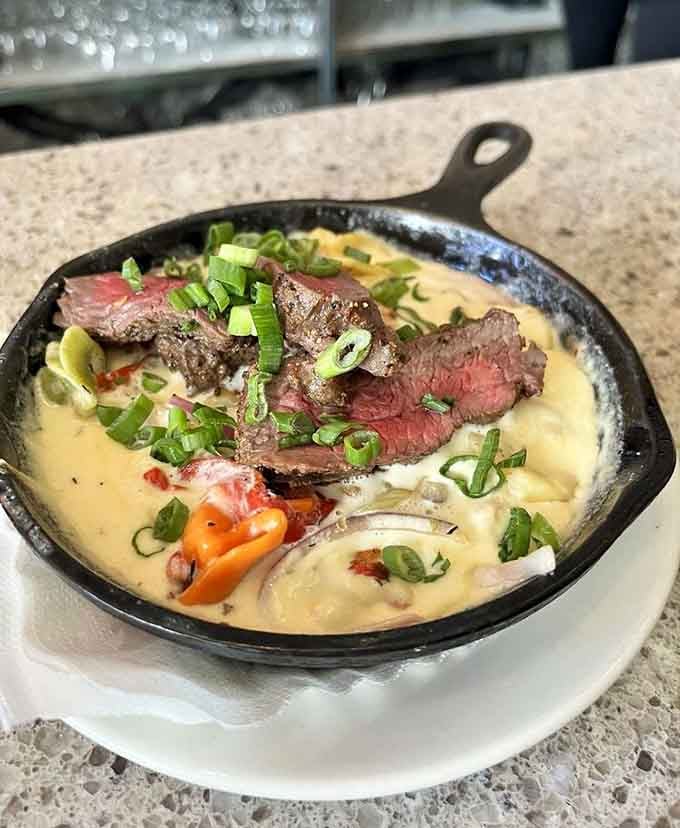That steak sits in Manchego cream sauce like it's taking a luxurious, delicious bubble bath for one.