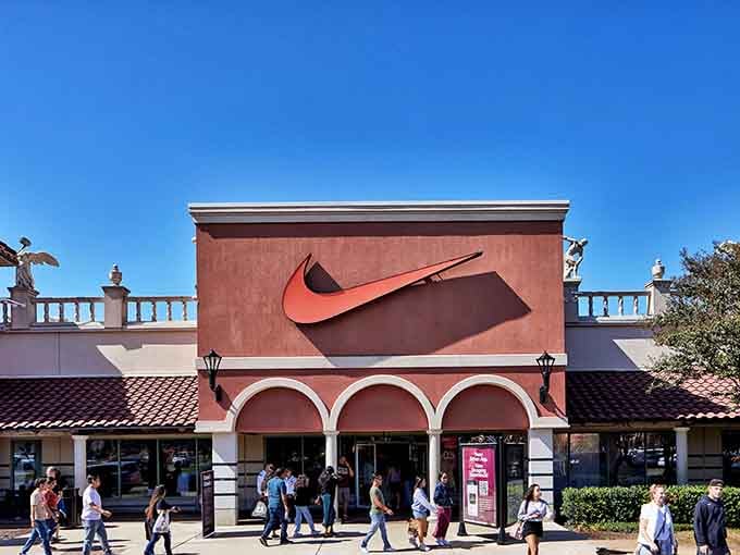 That iconic swoosh towers overhead, calling sneaker enthusiasts like a beacon of athletic footwear salvation.