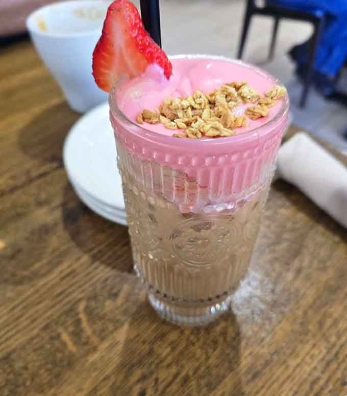 A fresas con crema latte that's prettier than most sunsets and tastes even better than it looks.