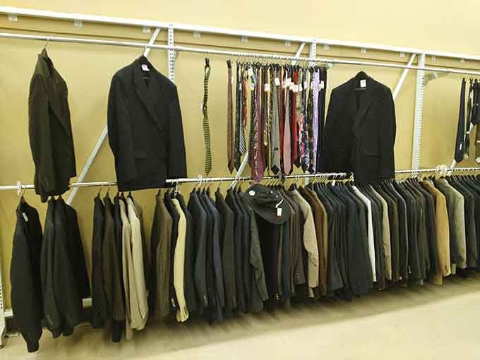 Suits and ties organized like a gentleman's dream closet, minus the country club membership fees required.