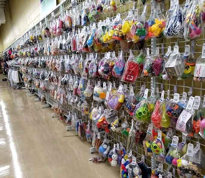 Toys hanging like a carnival midway, each one representing a kid's former favorite thing before the next trend arrived.