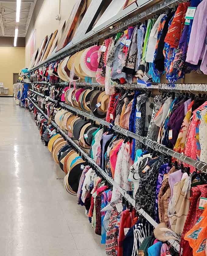 Colorful scarves and hats hang neatly in rows, each adding a stylish touch to any outfit.