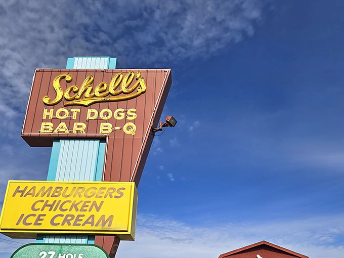 That vintage sign stands tall like a delicious lighthouse guiding hungry travelers to their happy place.