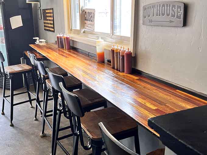 Long communal tables where strangers become friends over shared appreciation for properly smoked meats and mountain air conversations.