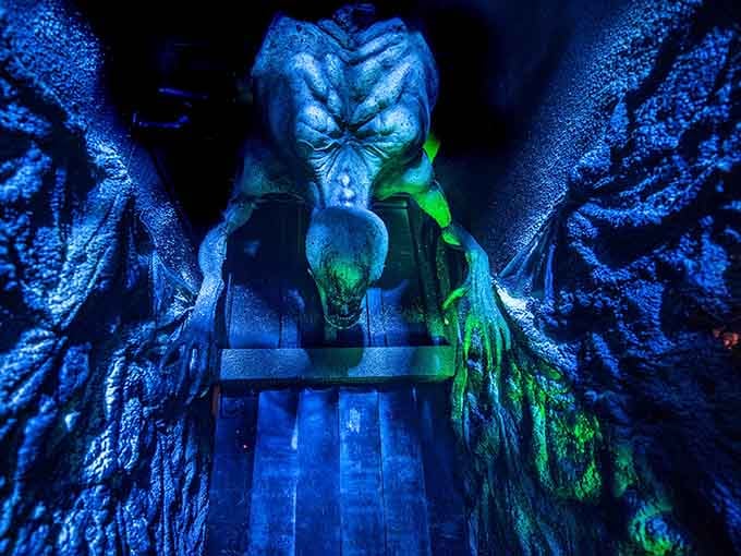 This towering creature bathed in eerie blue light proves that sometimes the biggest nightmares are the ones you can't run from.