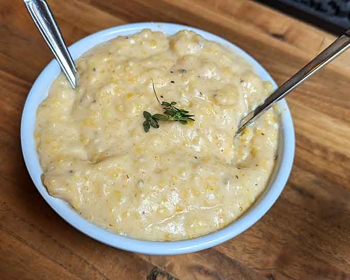 Creamy grits that look like they've been stirred with patience and love, the kind that make you reconsider your breakfast loyalties.