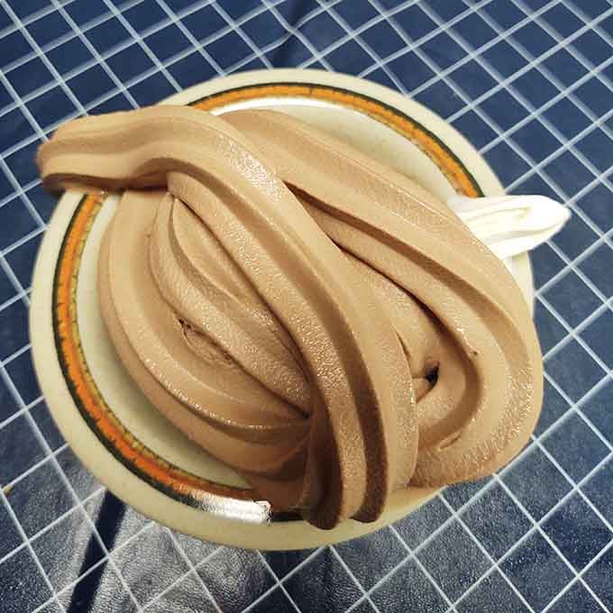 Soft serve ice cream that towers like a delicious architectural marvel, defying gravity and making everyone around you jealous instantly.