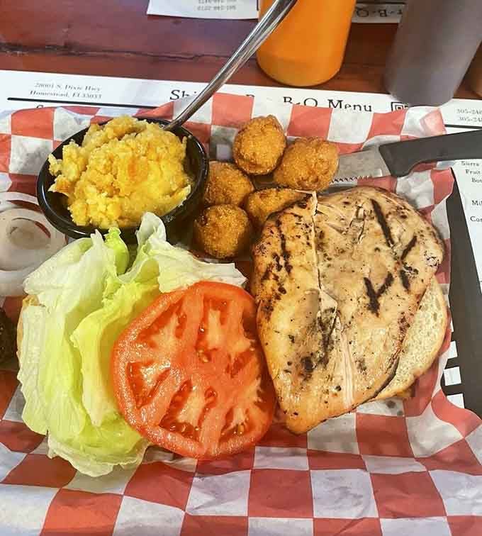 Even the grilled chicken gets star treatment here, with golden hush puppies stealing the supporting role.