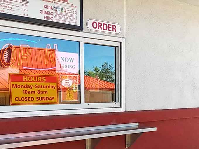 The order window where dreams become reality, one burger at a time, no reservations required for happiness.