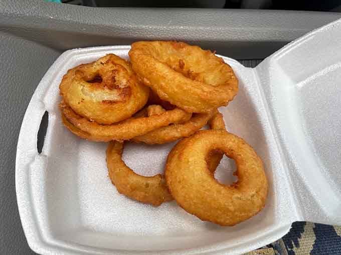 Onion rings fried to crispy perfection, the kind that make you forget about counting calories for a day.
