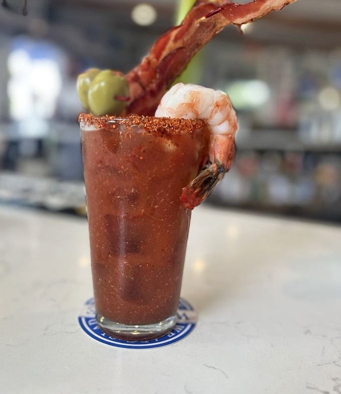 A Bloody Mary so loaded with garnishes it's practically a meal, featuring shrimp, bacon, and serious commitment.
