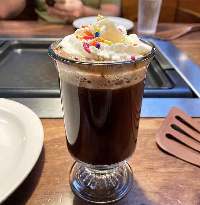 Hot chocolate topped with whipped cream and rainbow sprinkles brings out the kid in everyone, regardless of age.