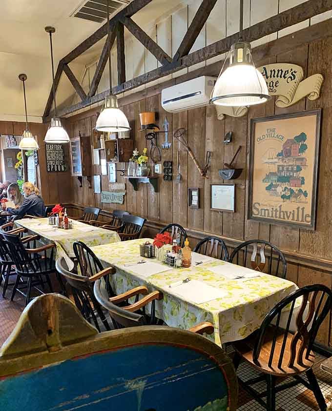 Vintage maps, cheerful tablecloths, and pendant lights create an atmosphere that says "stay awhile, friend" without saying anything at all.