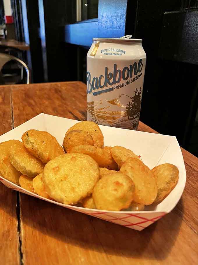 Golden fried pickles paired with local beer create the kind of snack situation that starts great conversations.