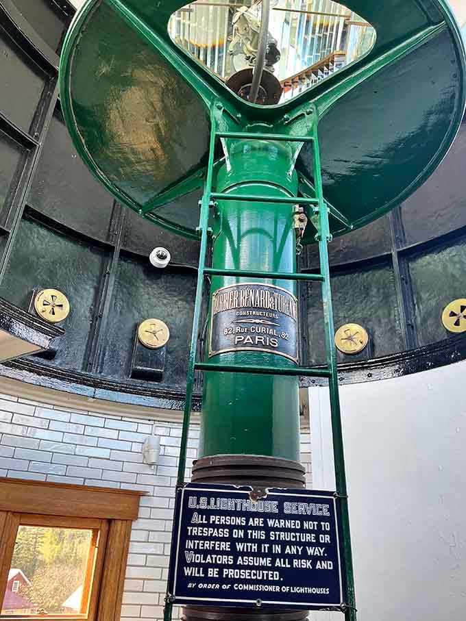 The original Fresnel lens gleams like a jewel, its intricate prisms still capable of projecting light across miles of water.