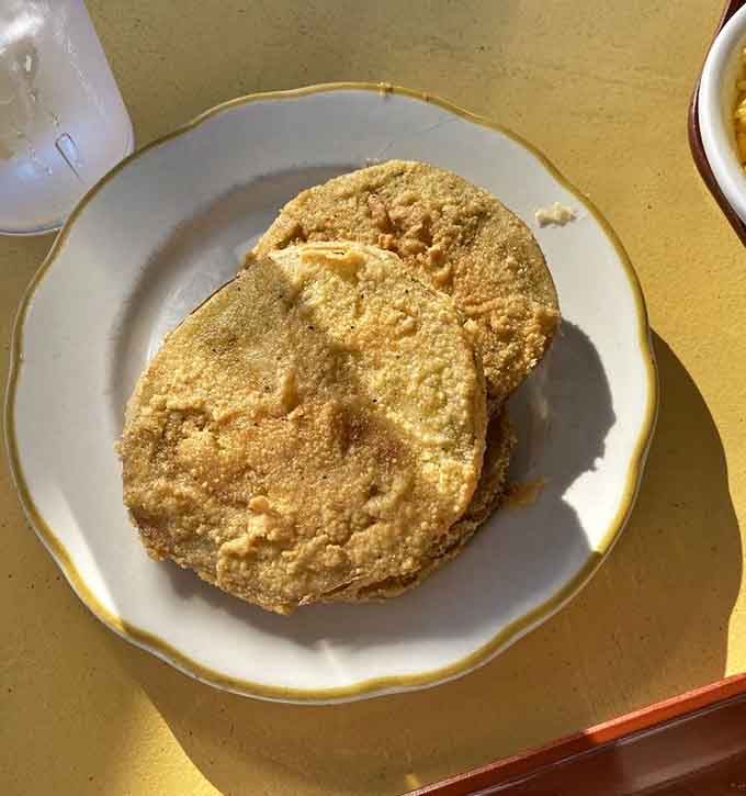 Fried green tomatoes with that perfect crispy coating, proving vegetables can be just as indulgent as any comfort food.