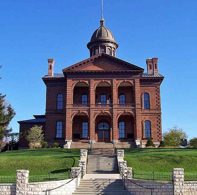 The Washington County Courthouse commands its hilltop perch like a Victorian-era wedding cake made of brick and ambition.