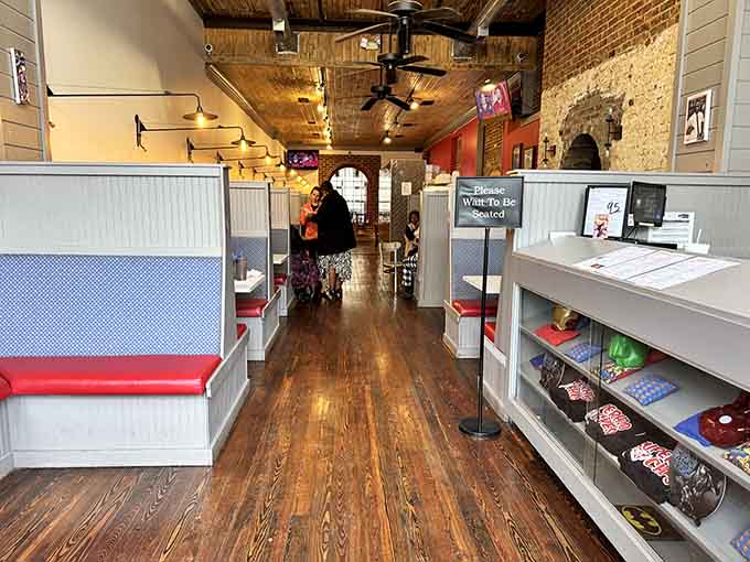 Classic diner booths with a twist, where Batman masks on the wall remind you breakfast should be fun.