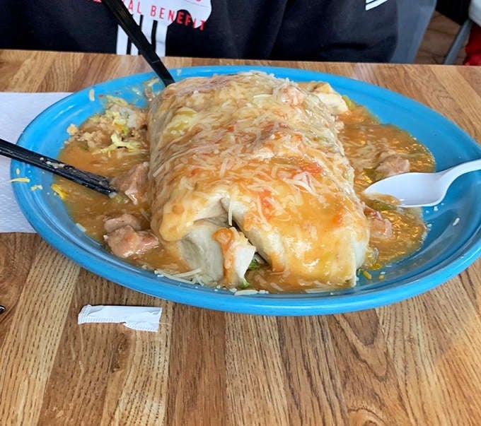 That Monster Burrito smothered in green chile and melted cheese lives up to every syllable of its name.