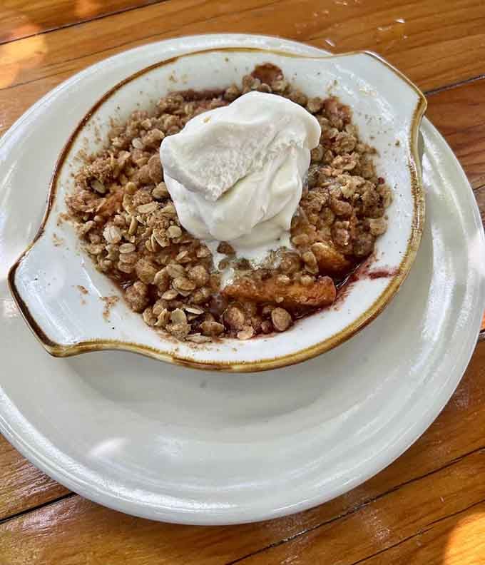 Warm cobbler with whipped cream is how you end a barbecue feast when you're doing life correctly.