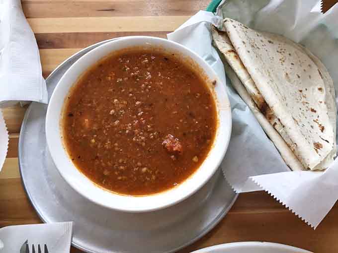 Fresh tortillas and a bowl of green chile—the Colorado breakfast starter pack that never gets old or boring.