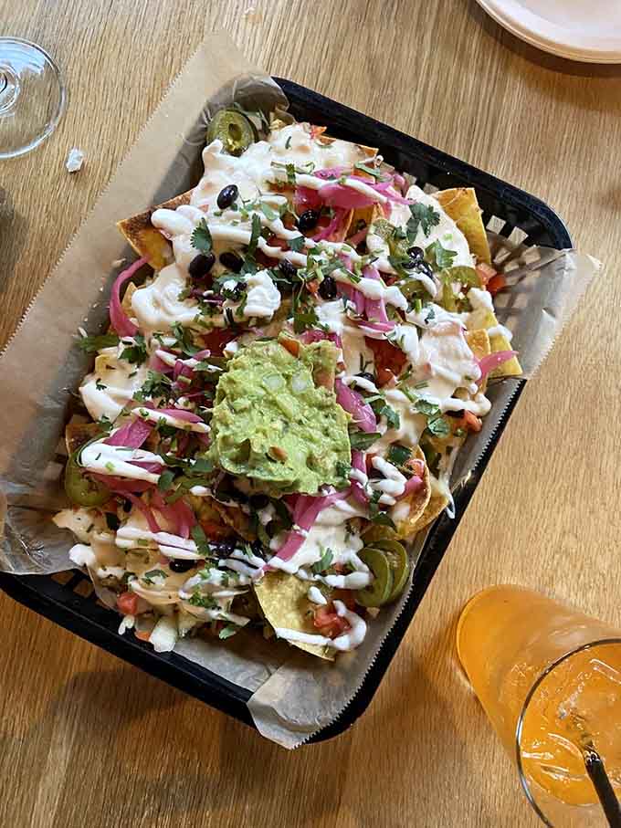 Loaded nachos with all the fixings including guacamole, because sometimes you need to start big and hungry.