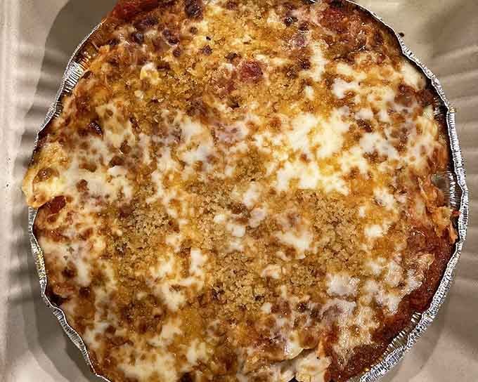 Golden-brown perfection in a tin, proving that sometimes the simplest pizzas are the ones that haunt your dreams.