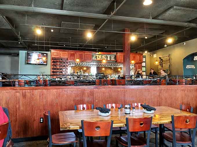 The bar area gleams with promise, showcasing wines and spirits that pair perfectly with adventurous small plates dining.