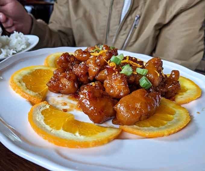 Orange chicken that's sticky, sweet, and arranged prettier than most people's wedding photos these days.