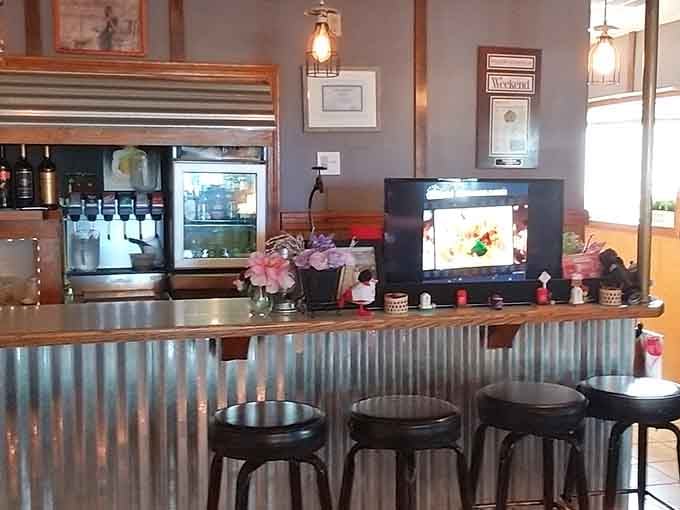 Counter seating with corrugated metal paneling, because who says diners can't get a Thai-inspired industrial chic makeover?
