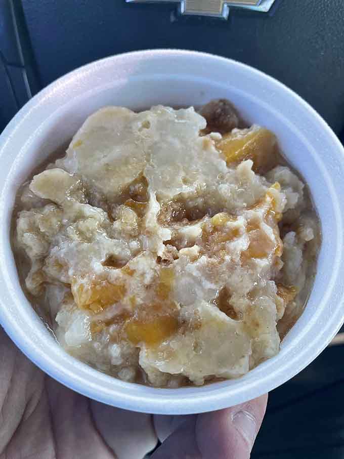 Peach cobbler crowned with vanilla ice cream, melting into sweet oblivion like a Tennessee Williams summer afternoon.