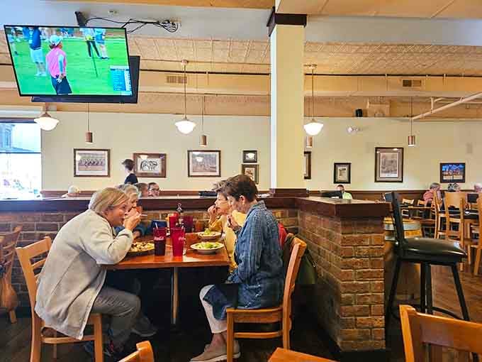 Real people enjoying real meals in a space that feels welcoming - no pretense, just good food and conversation flowing.