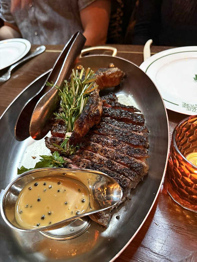 That porterhouse arrives with the kind of char marks that make steak lovers weak in the knees, perfectly cooked throughout.