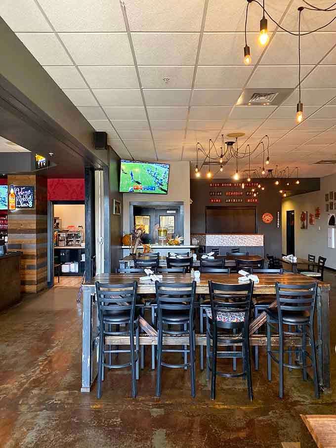 High-top seating and pendant lighting set the stage for conversations that last longer than the meal itself.