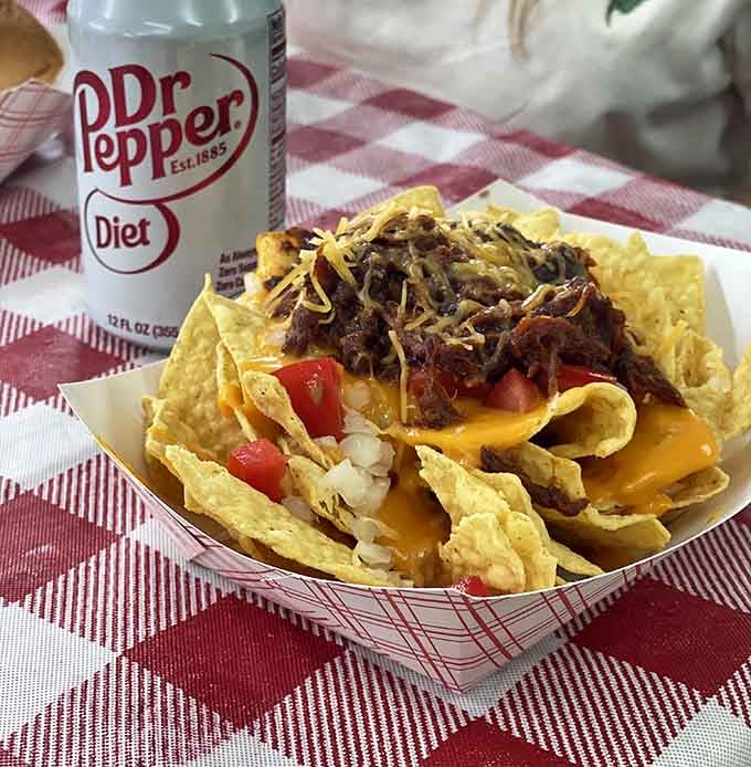 Loaded nachos piled high with all the fixings prove this place knows comfort food isn't just about hot dogs alone.