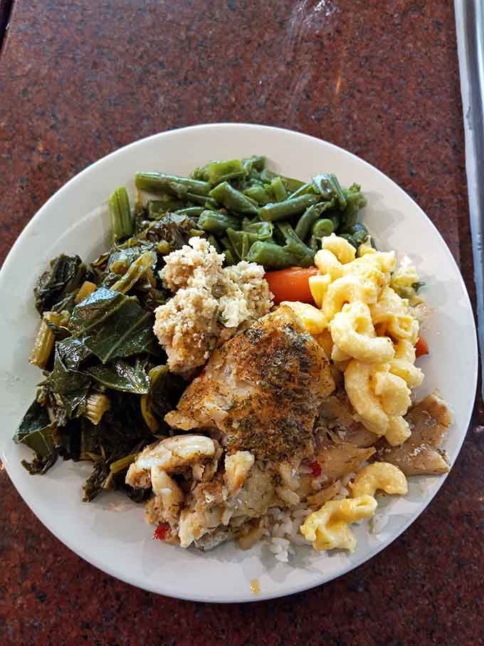 This plate tells the whole story: seasoned chicken, creamy mac and cheese, and greens cooked low and slow.