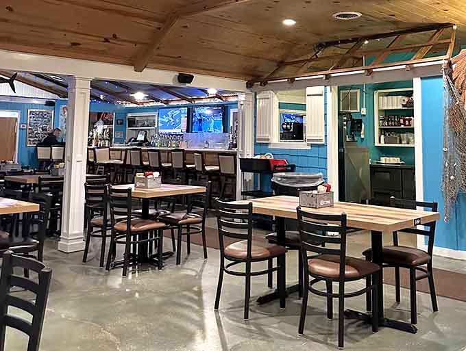 The dining area where cold drinks flow freely and the nautical decor reminds you exactly where you are.