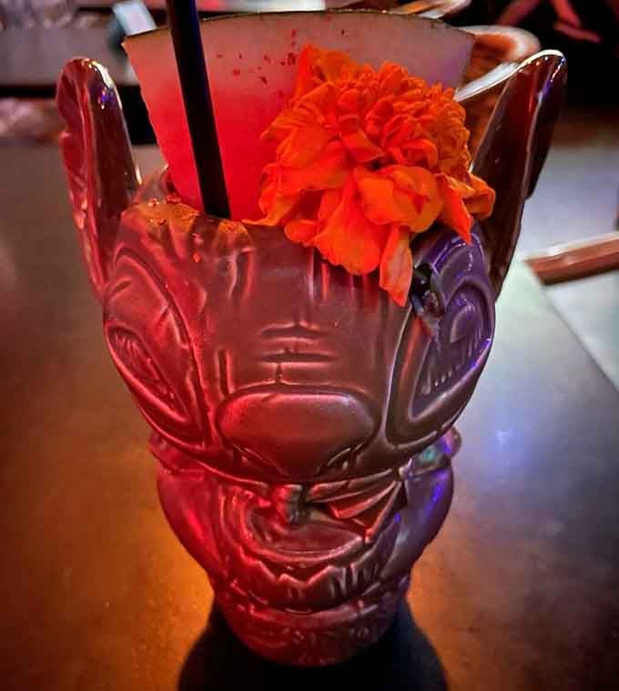 A tiki mug with an attitude and a flower crown, serving up tropical vibes one sip at a time.