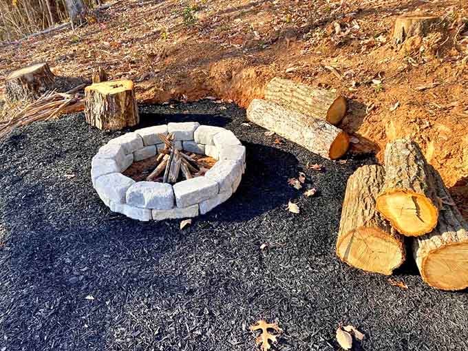 Gather around this stone fire pit with log seating where s'mores taste better and stories sound more interesting somehow.
