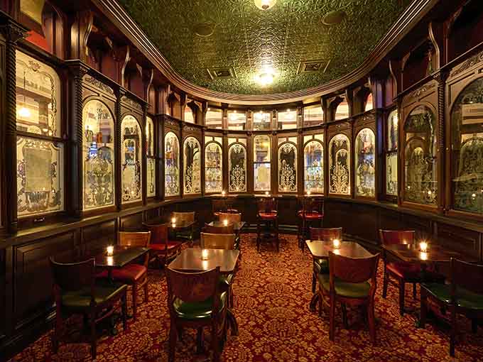 The ornate woodwork and etched glass panels transport you somewhere special without requiring a passport or plane ticket.